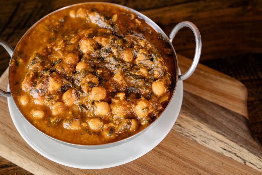 chana saag chickpeas cooked with garlic onion spinach in a
